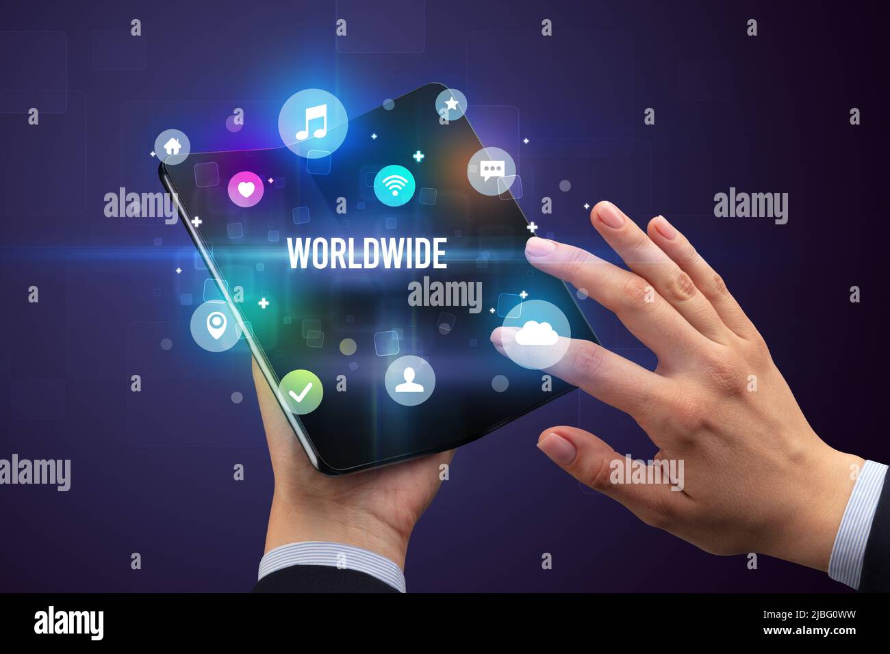 Businessman holding a foldable smartphone Stock Photo - Alamy