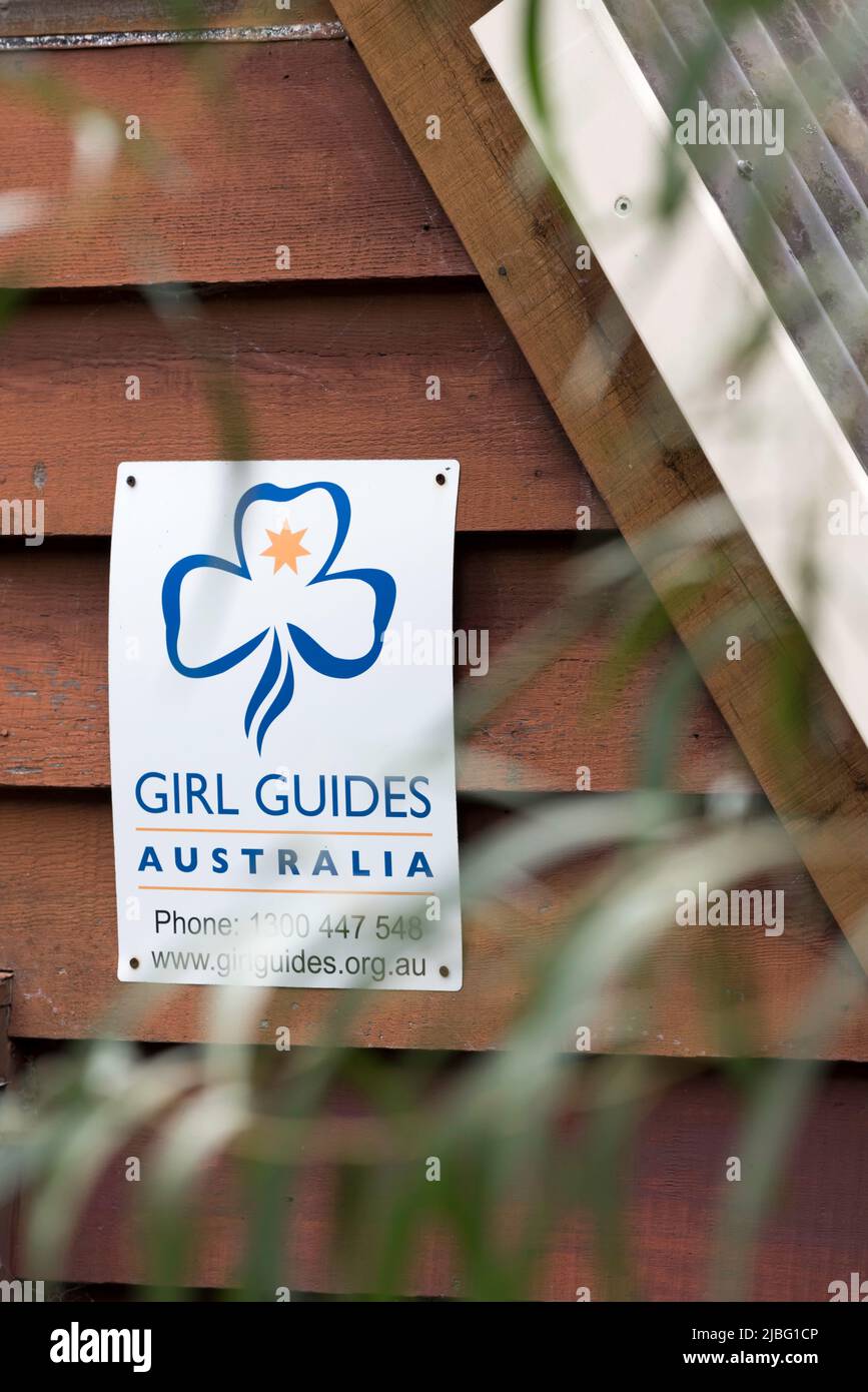 A close up of a Girl Guides Australia sign at the front of a timber A ...