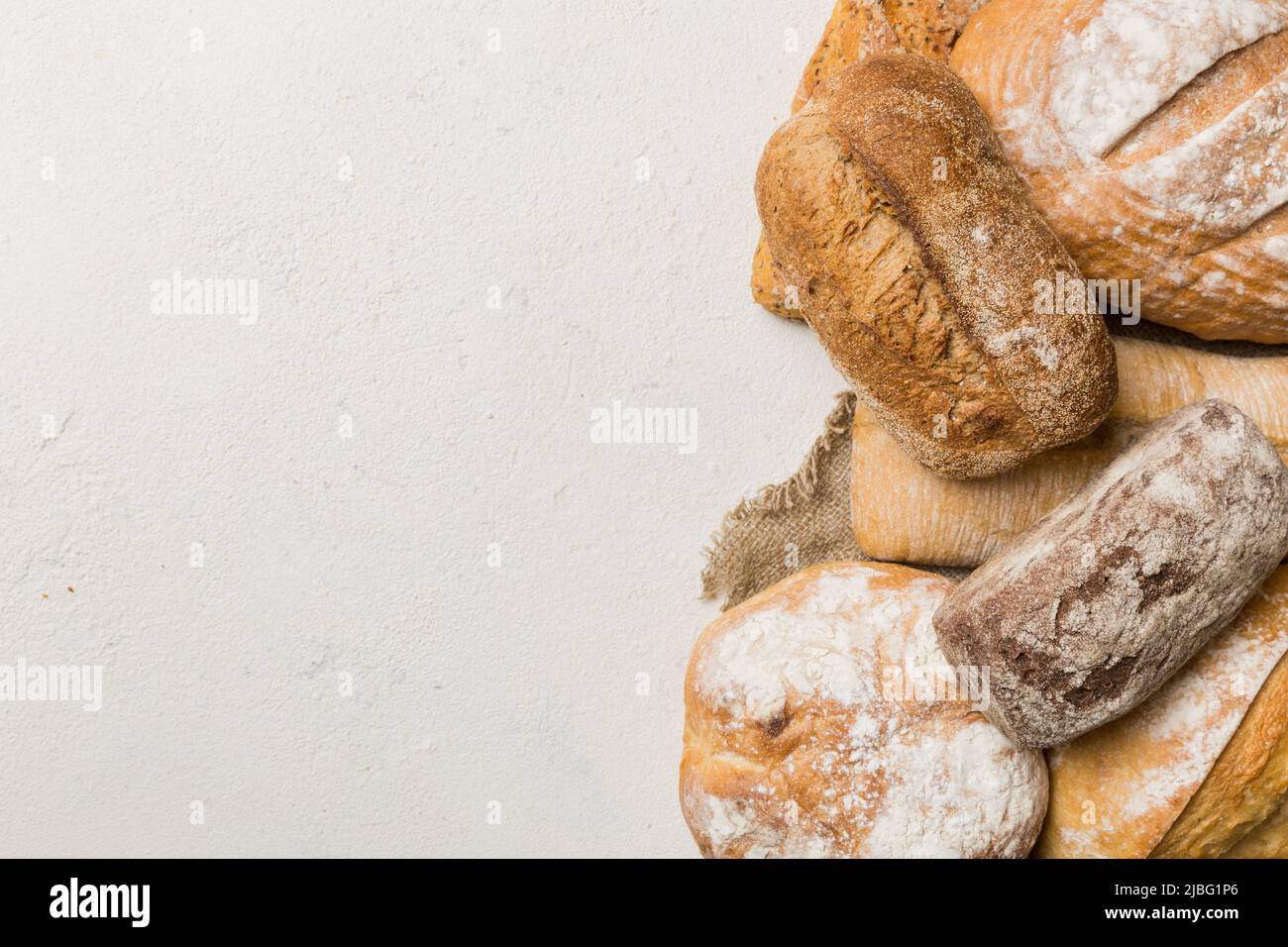 Homemade natural breads. Different kinds of fresh bread as background ...