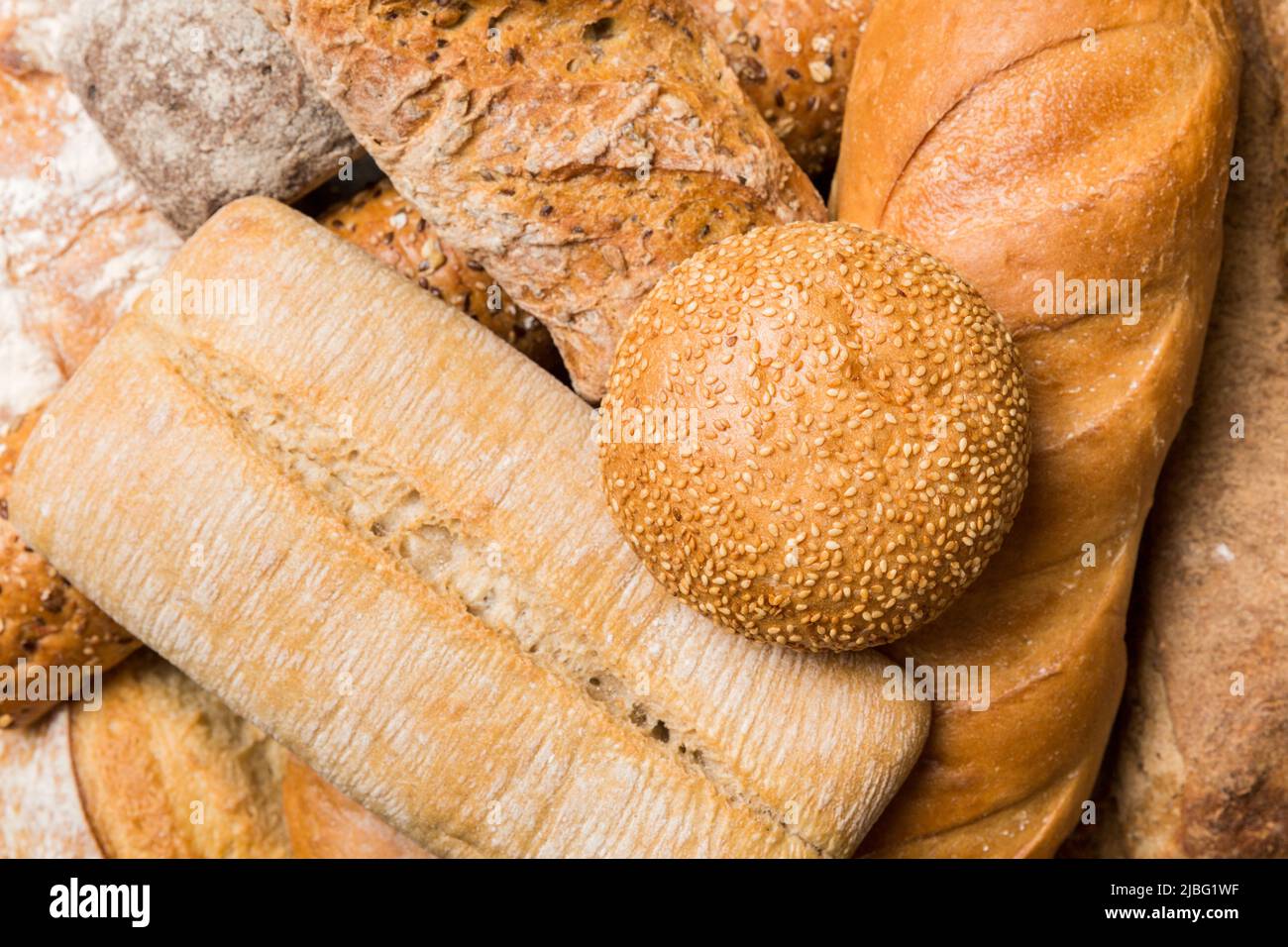 Homemade natural breads. Different kinds of fresh bread as background ...