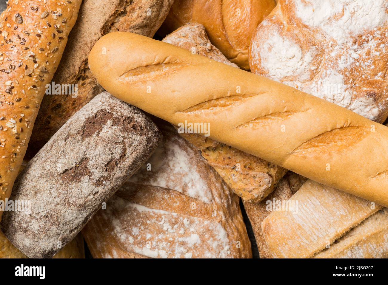 Homemade natural breads. Different kinds of fresh bread as background ...