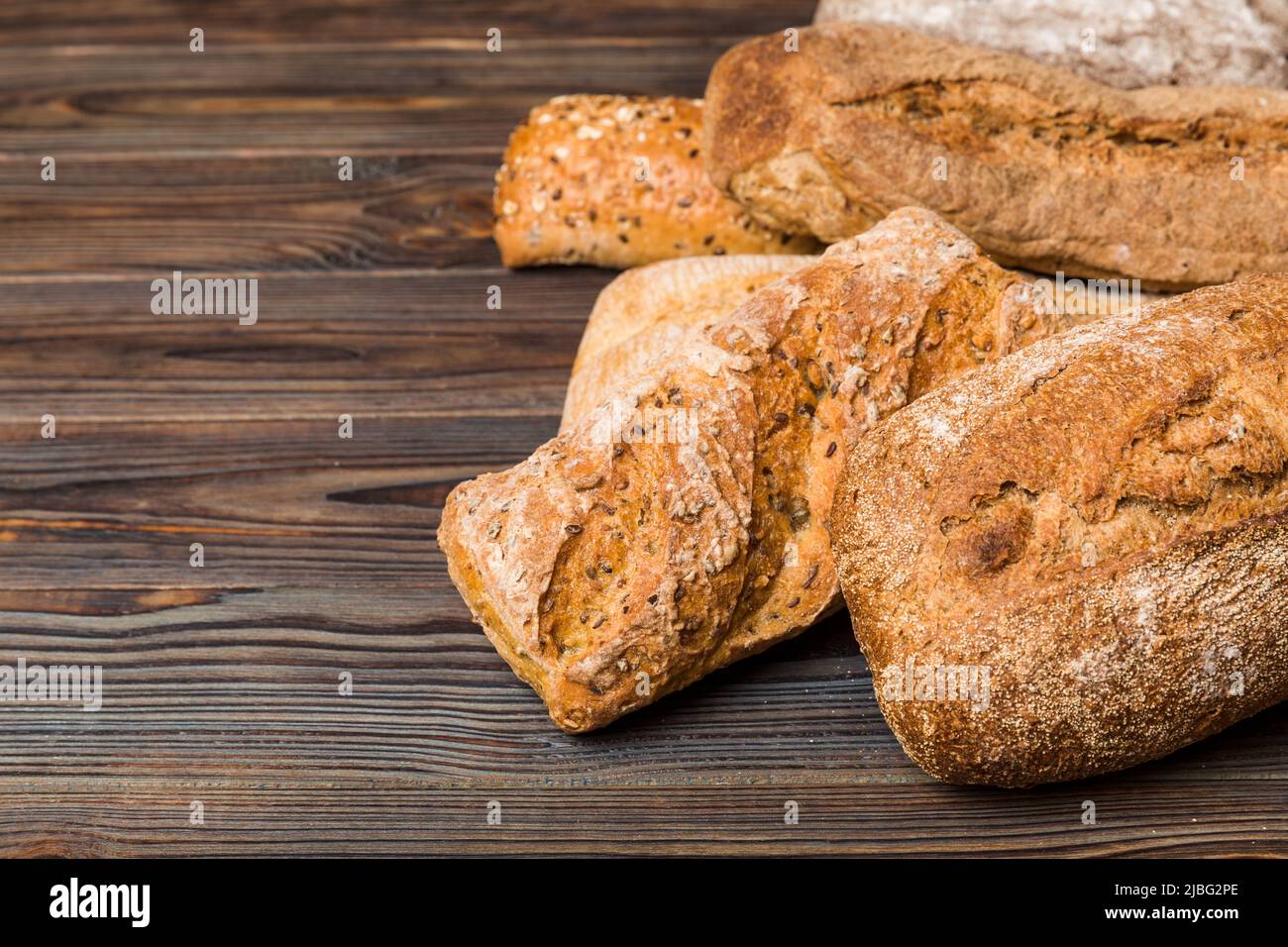 Homemade natural breads. Different kinds of fresh bread as background ...