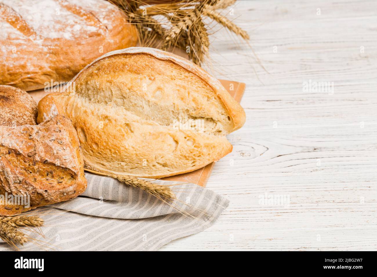Homemade natural breads. Different kinds of fresh bread as background ...