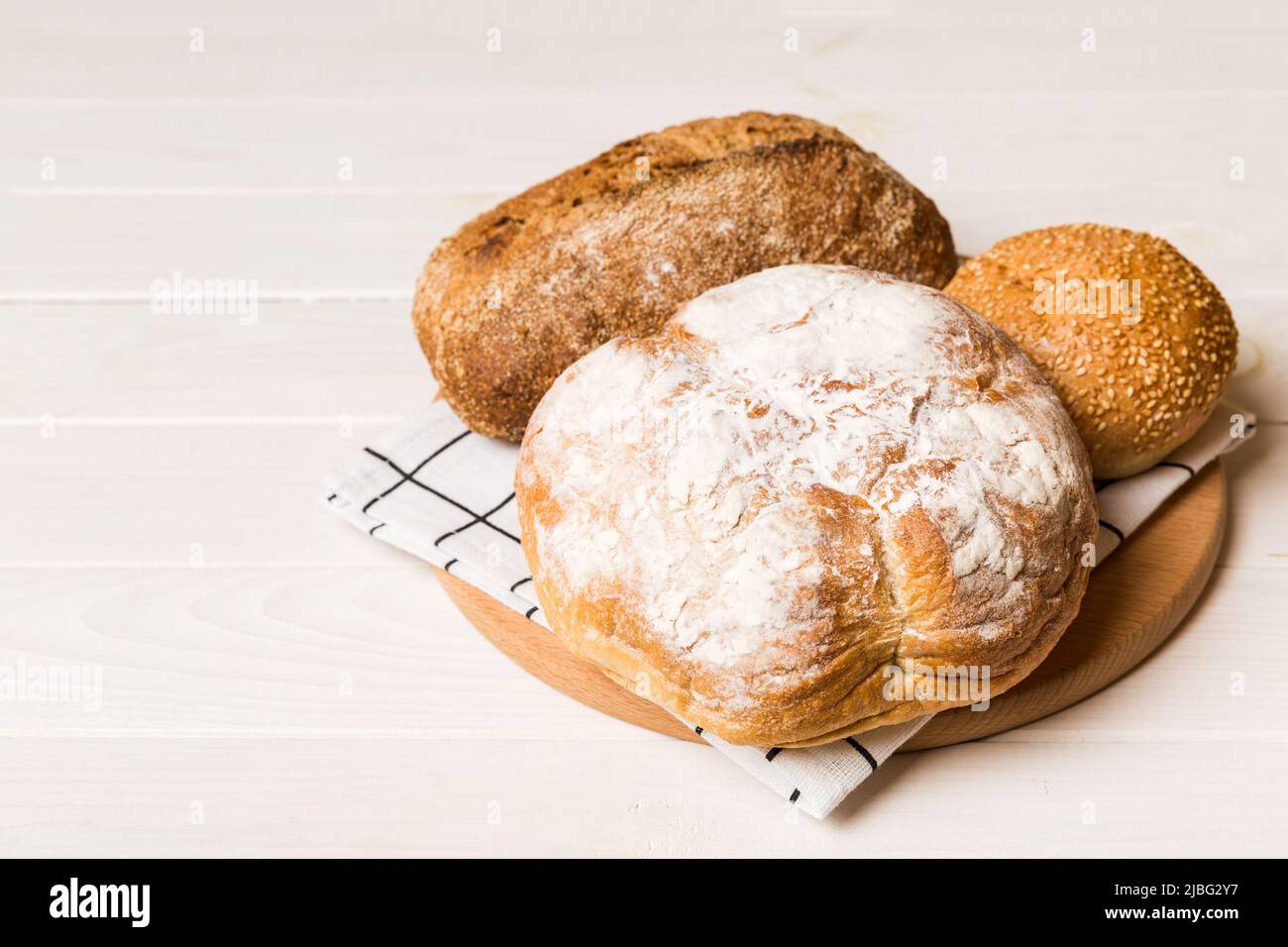 Homemade natural breads. Different kinds of fresh bread as background ...