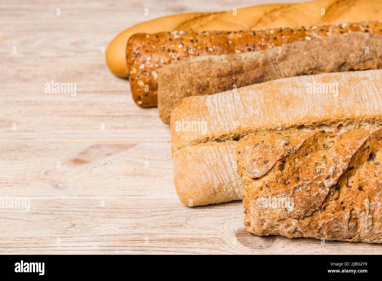 Homemade natural breads. Different kinds of fresh bread as background ...