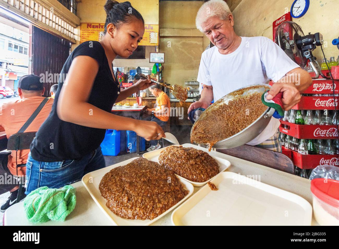 Freshly cooked biko transferred into trays at a local restaurant in ...