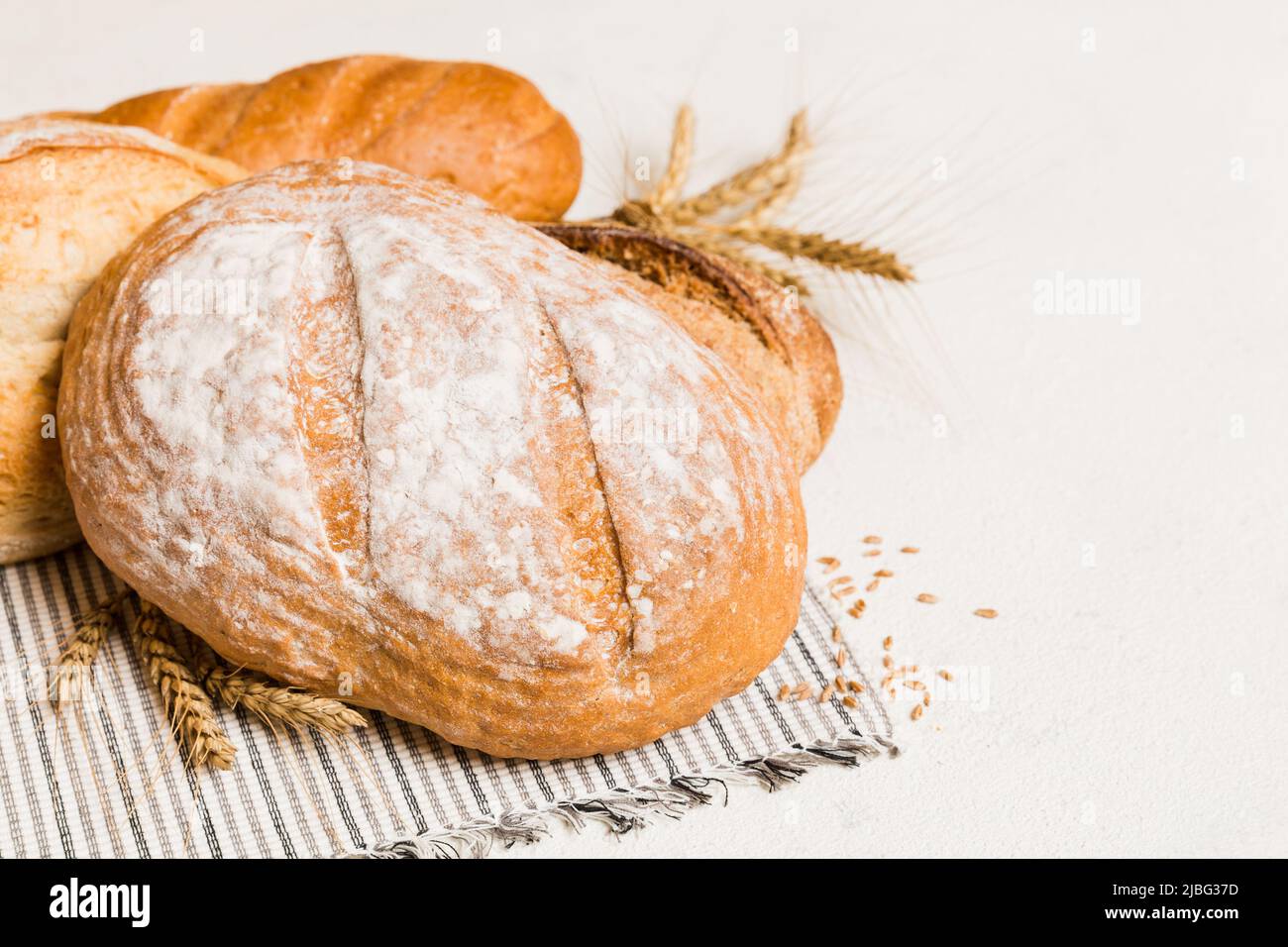Homemade natural breads. Different kinds of fresh bread as background ...