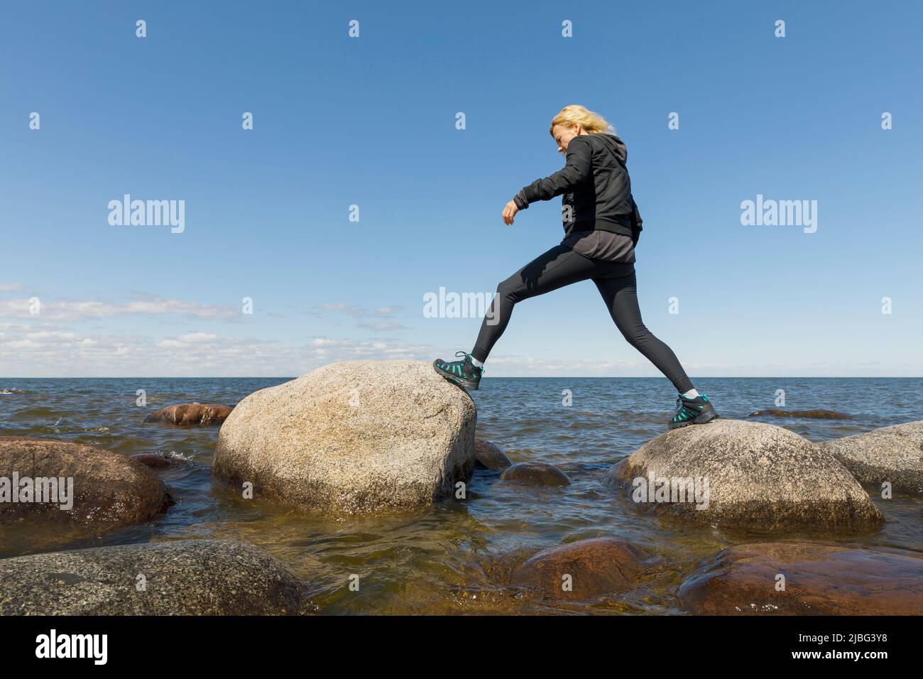 Adult walking down rocks hi-res stock photography and images - Alamy