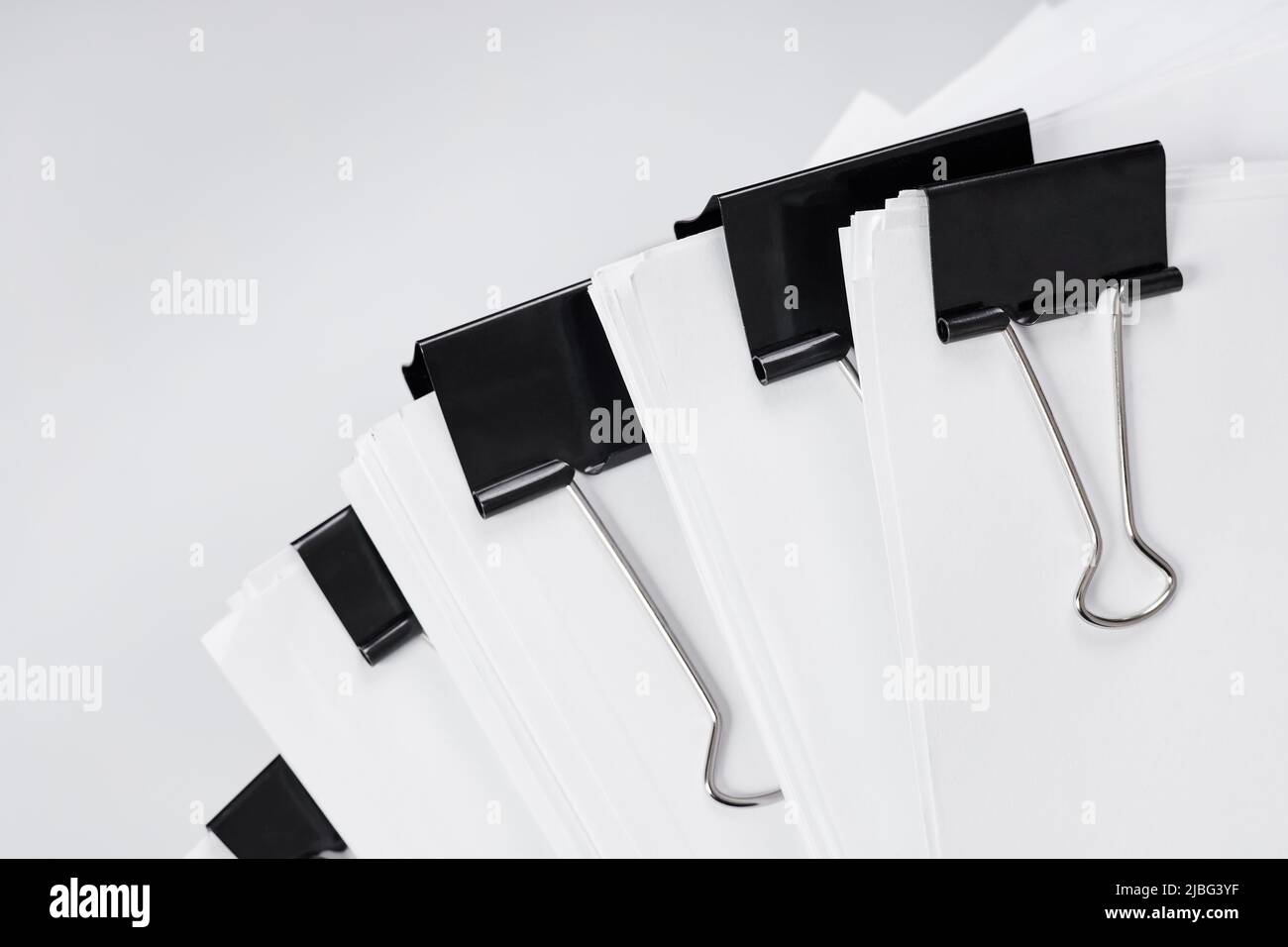 Blank Office papers fastened with black binders Stock Photo - Alamy