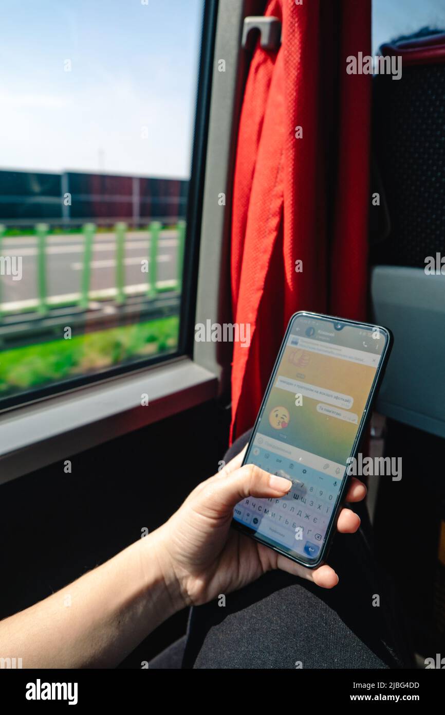 phone in woman hand riding on bus Stock Photo - Alamy