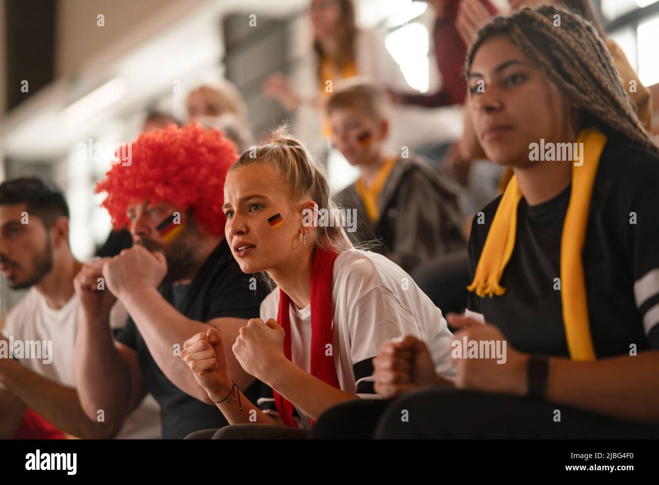 Worried football fans supproting German national team in live soccer ...