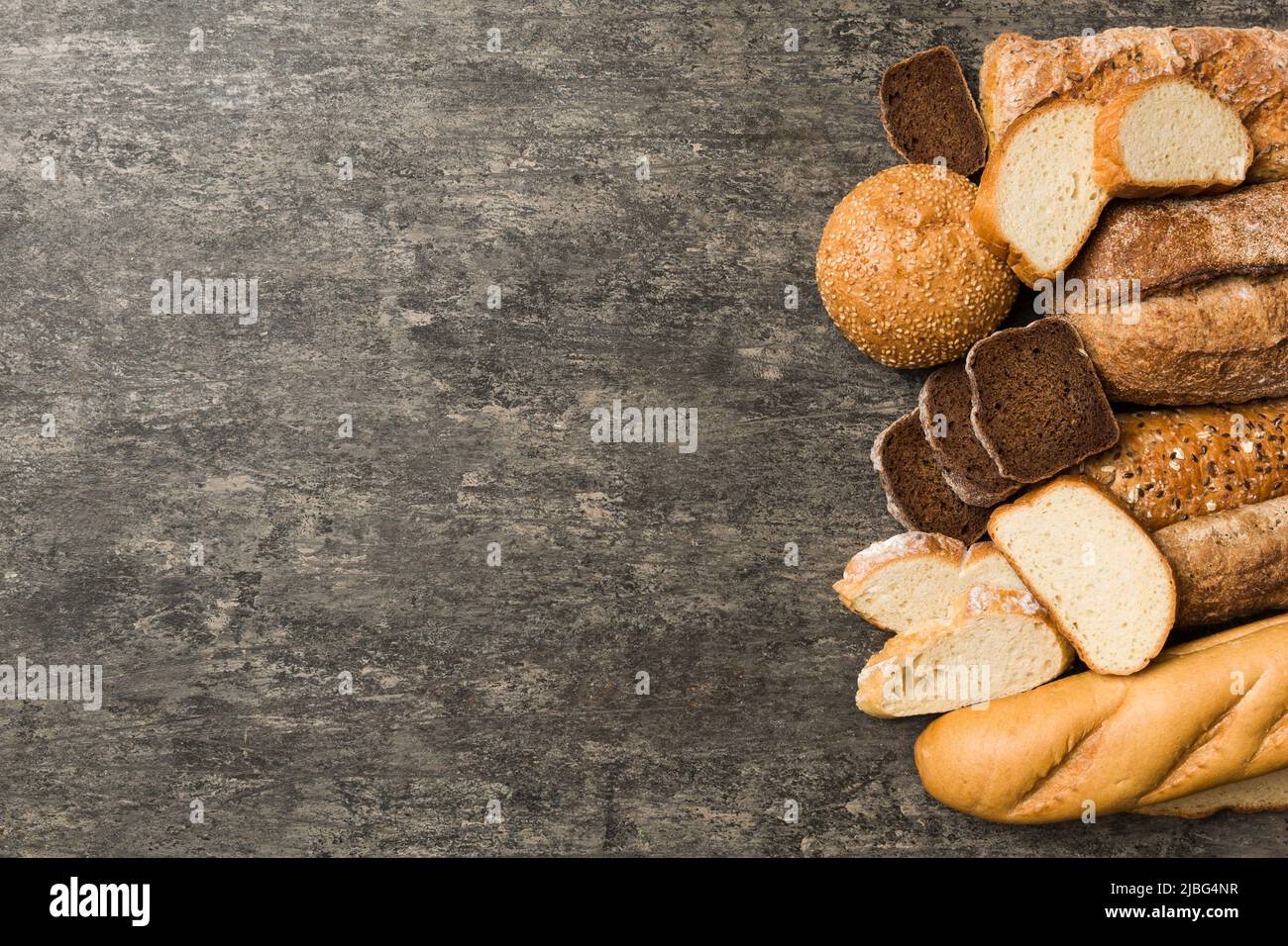 Homemade natural breads. Different kinds of fresh bread as background ...