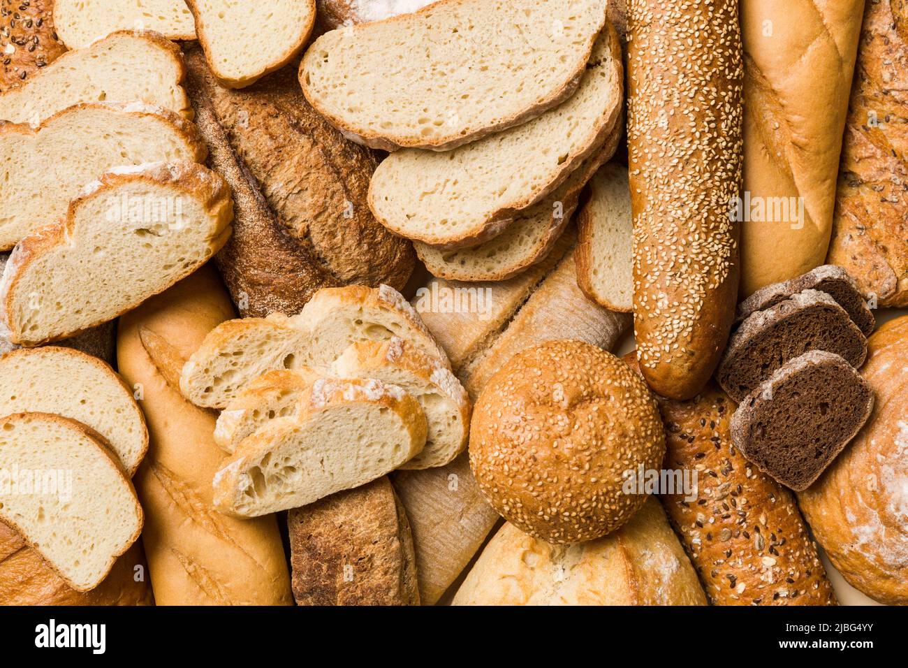 Homemade natural breads. Different kinds of fresh bread as background ...