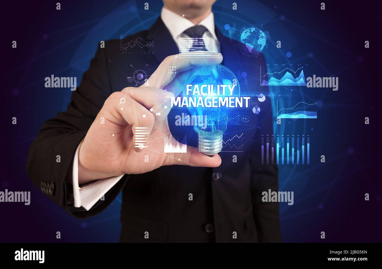 Businessman holding a light bulb, new business concept Stock Photo - Alamy