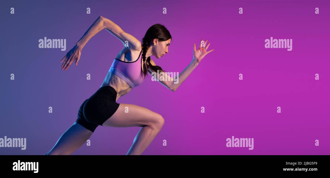 One young muscular girl, female runner or jogger training isolated on ...