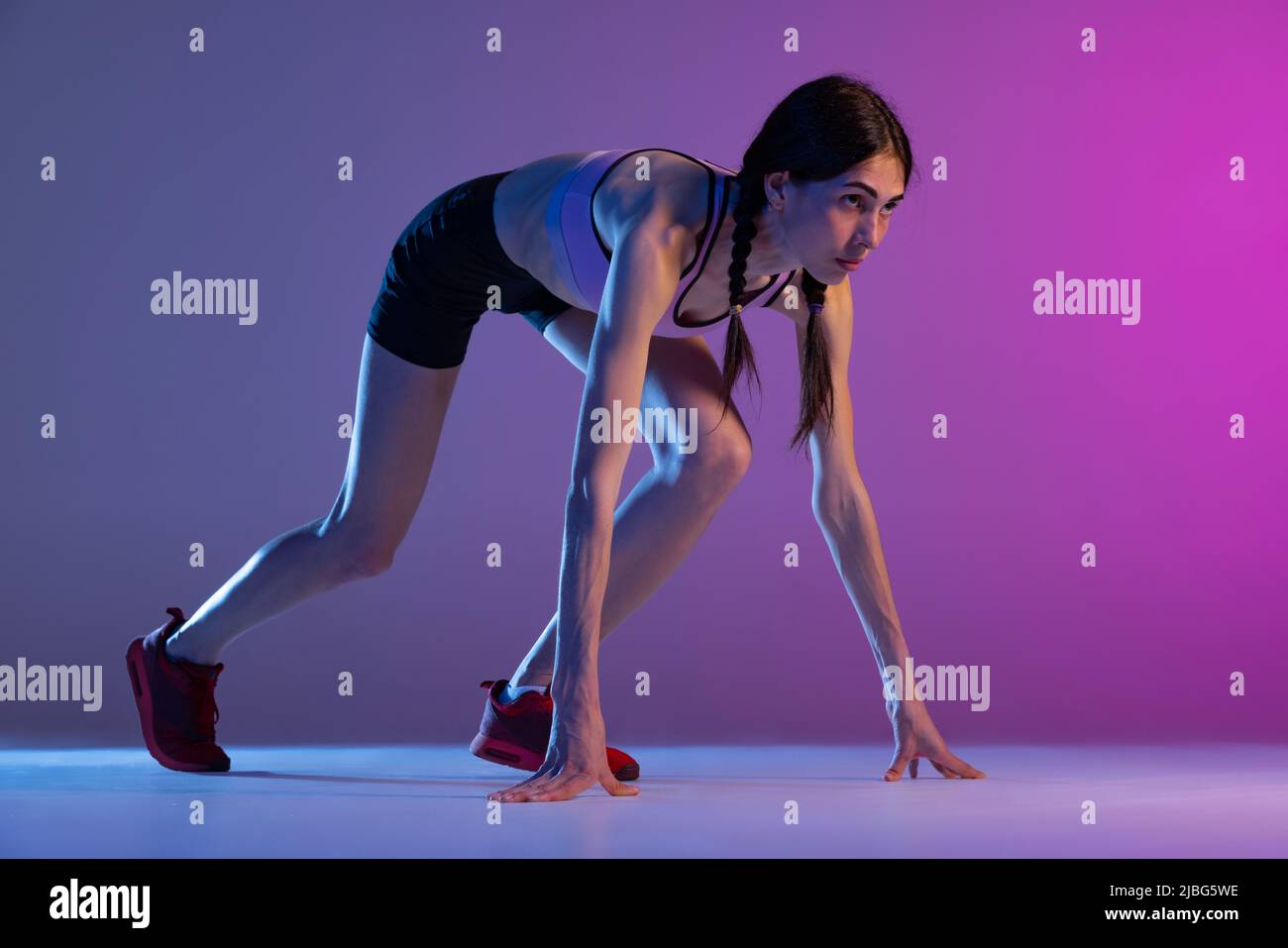 One young muscular girl, female runner or jogger training isolated on ...