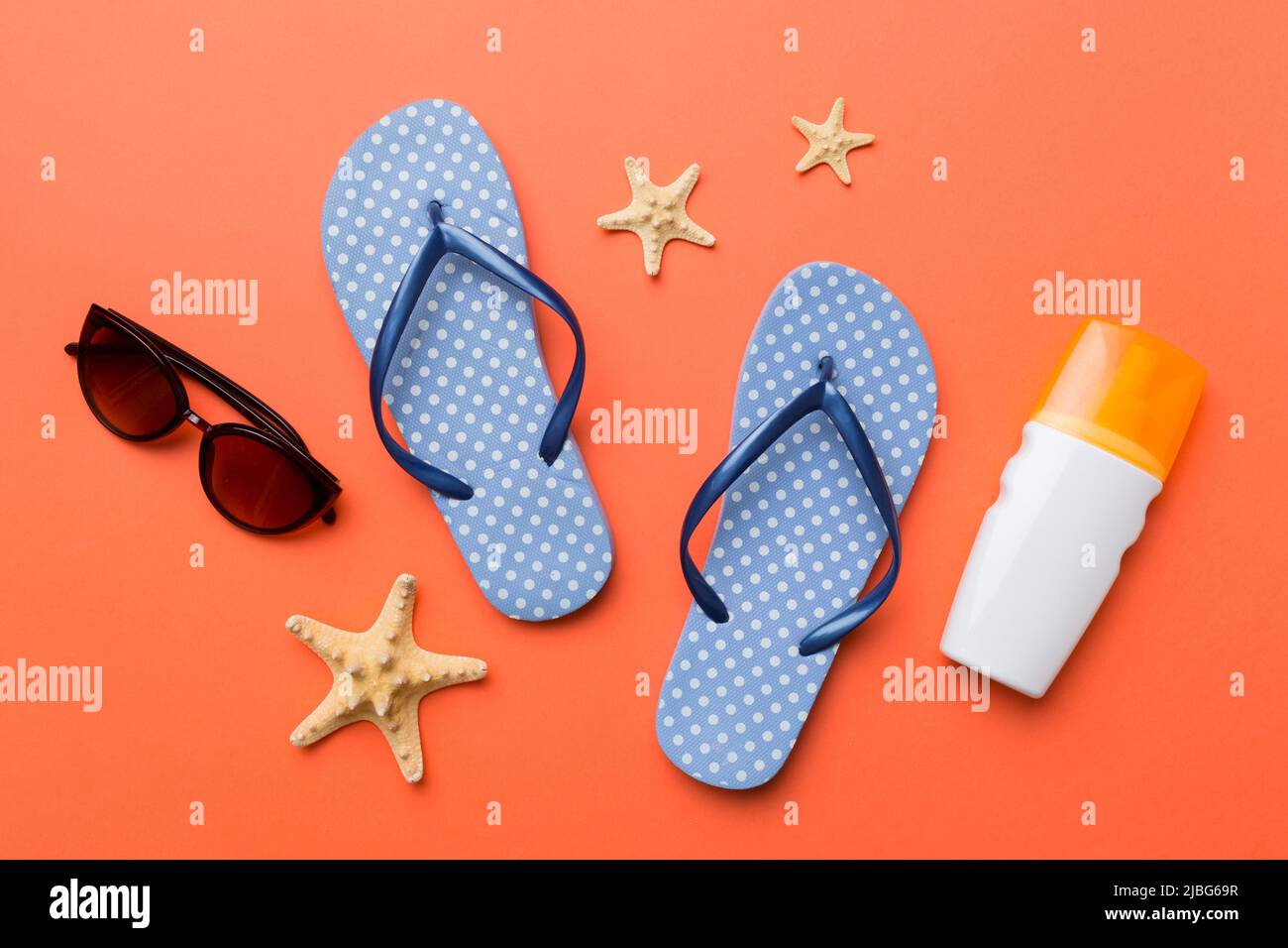 Summer travel concept. Flip flops, sunglasses and starfish on white ...