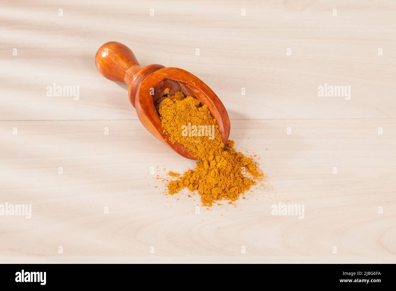 Turmeric Powder (Curcuma longa); Photo on wooden background Stock Photo ...