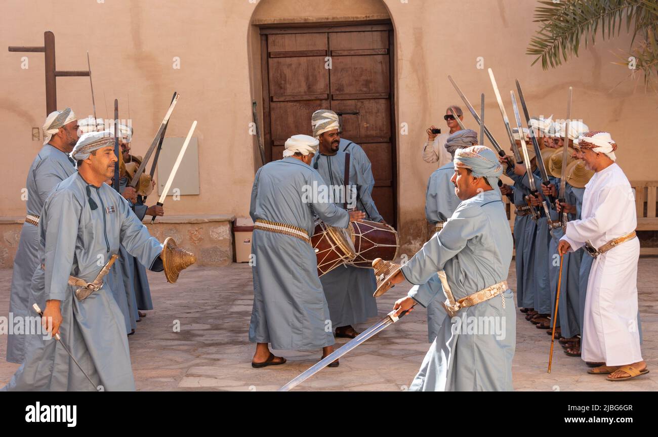 Traditional Omani Razha (or Azhi) sword dance performed by men in ...