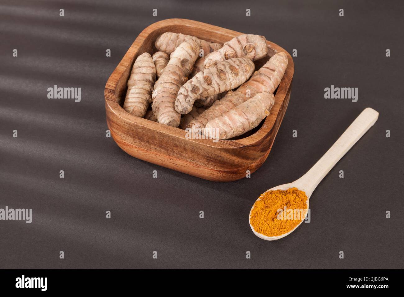 Turmeric - Curcuma longa root and turmeric powder; Photo on dark ...