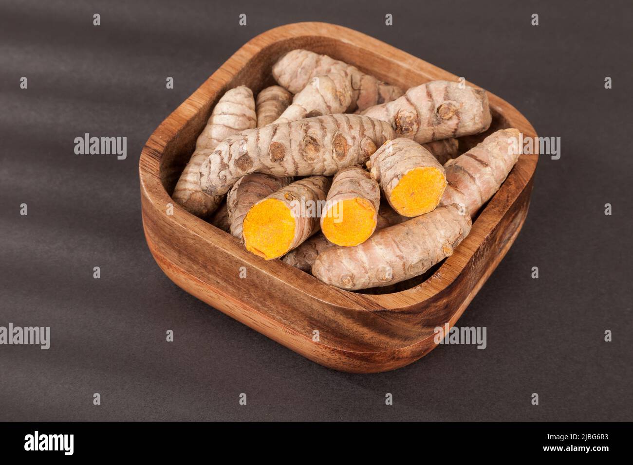 Roots of turmeric (Curcuma longa) Photo on dark background Stock Photo ...