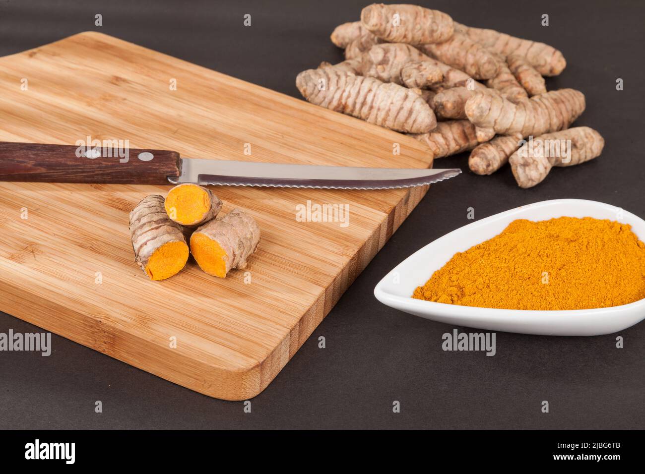 Turmeric - Curcuma longa root and turmeric powder; Photo on dark ...