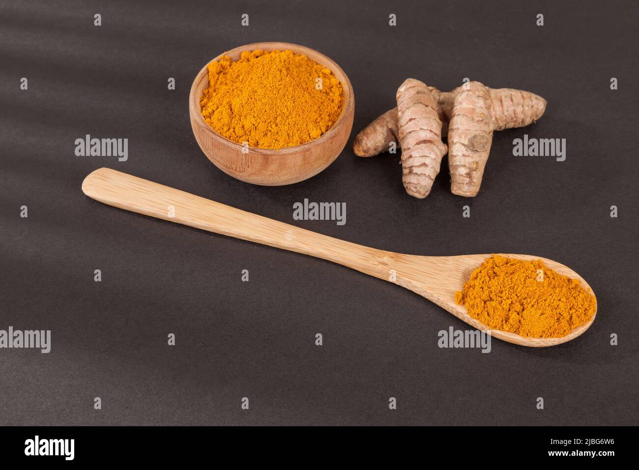 Turmeric - Curcuma longa root and turmeric powder; Photo on dark ...