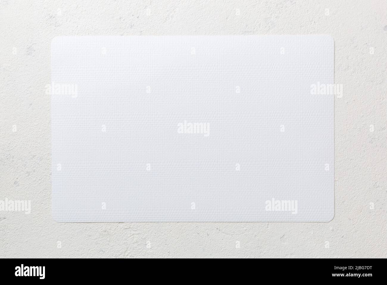 Top view of light tablecloth for food on cement background. Empty space ...