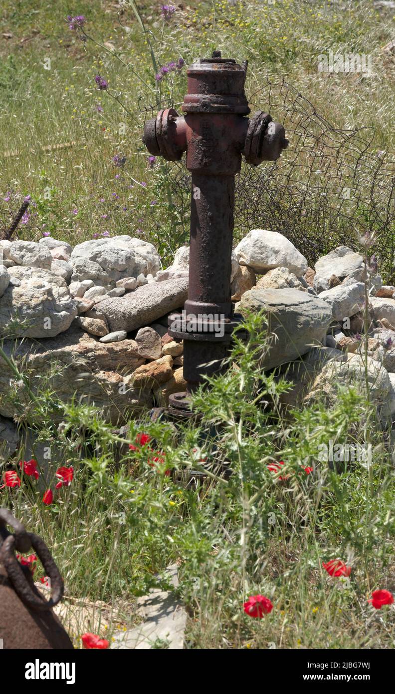 Water hydrant by the roadside. Tilos isand, Dodecanese, Greece Stock ...