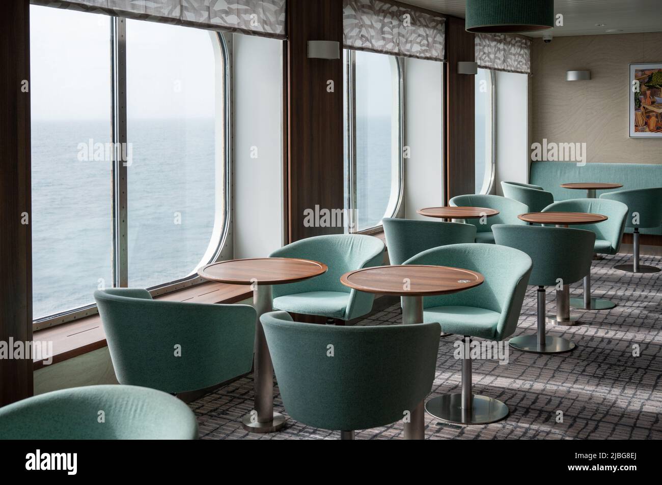A lounge area on the Brittany Ferries ship Galicia ferry with tables ...