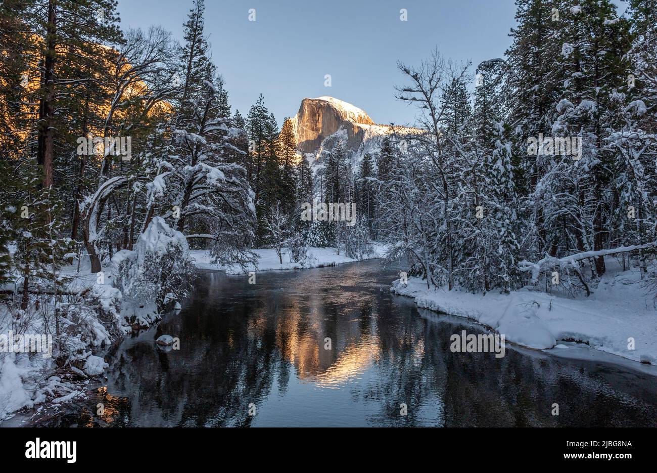 The peak of half dome is baking in the full light of the setting sun ...