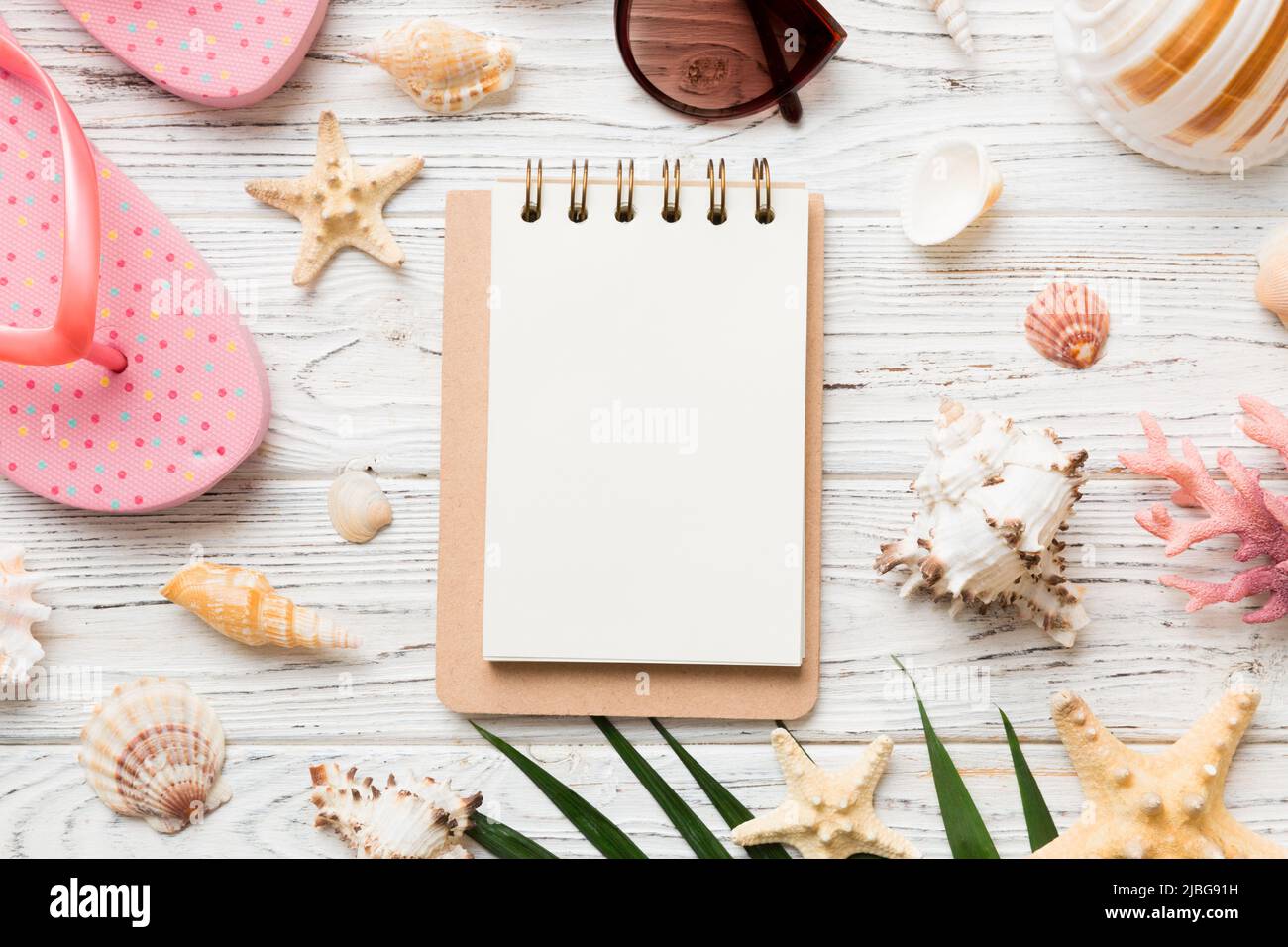 Blank writing book with summer beach accessories on background, copy ...