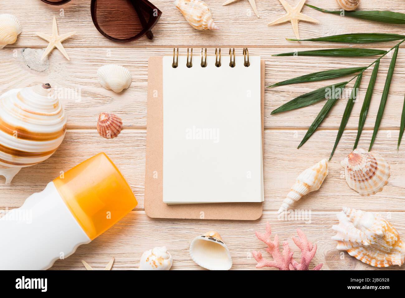 Blank writing book with summer beach accessories on background, copy ...