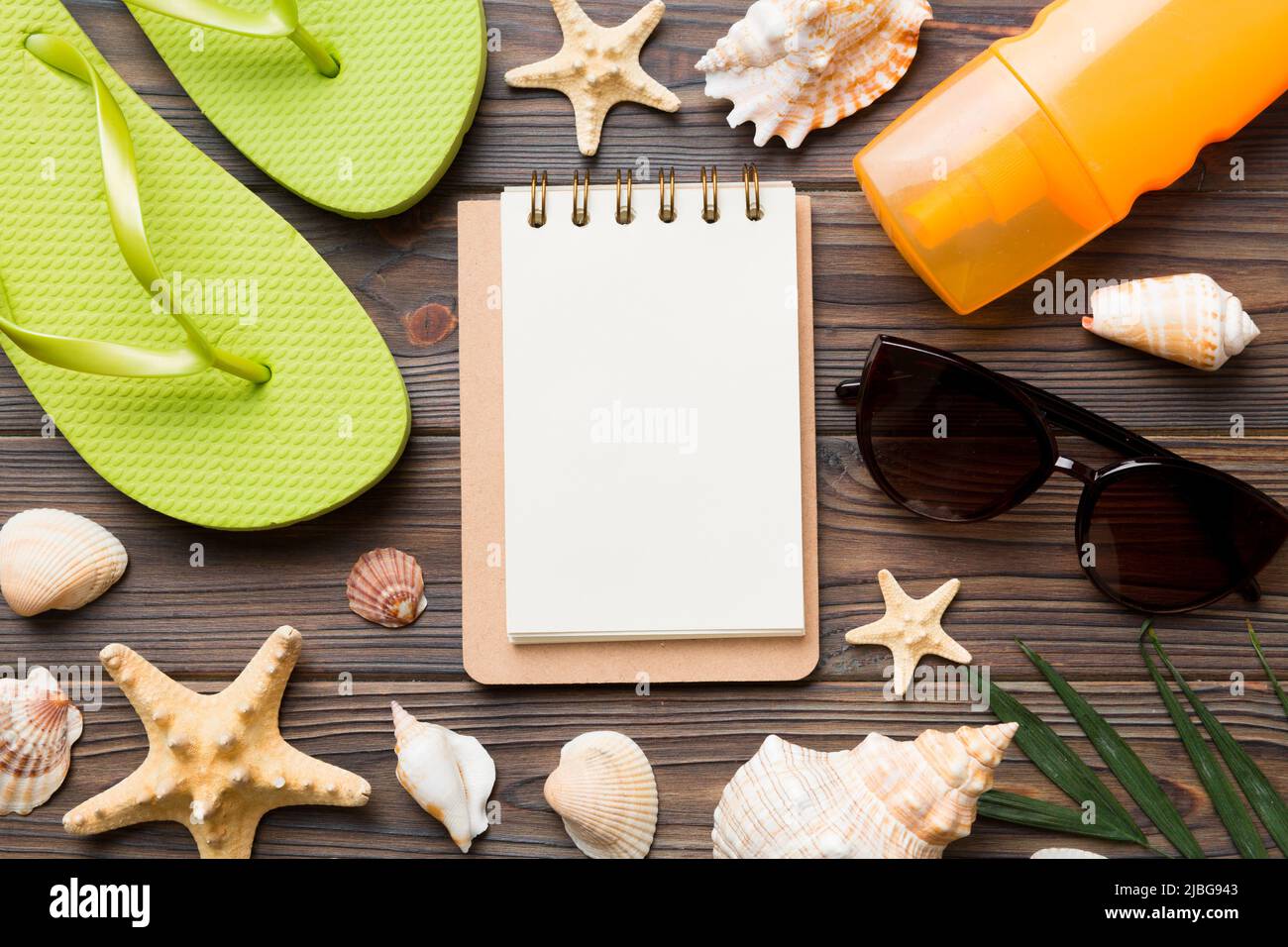 Blank writing book with summer beach accessories on background, copy ...