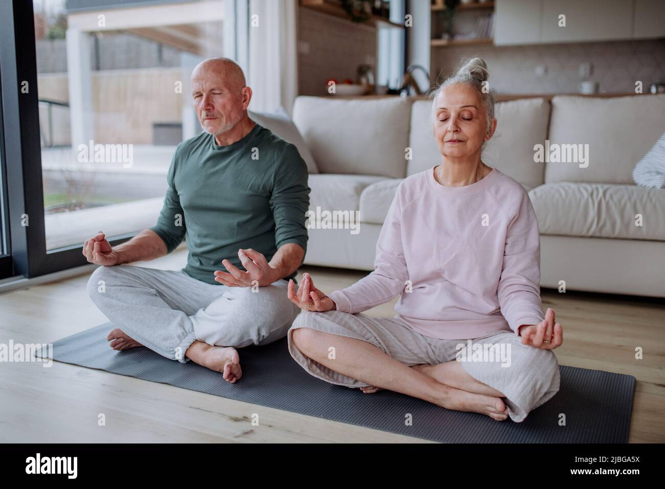 Couple home doing yoga hi-res stock photography and images - Alamy