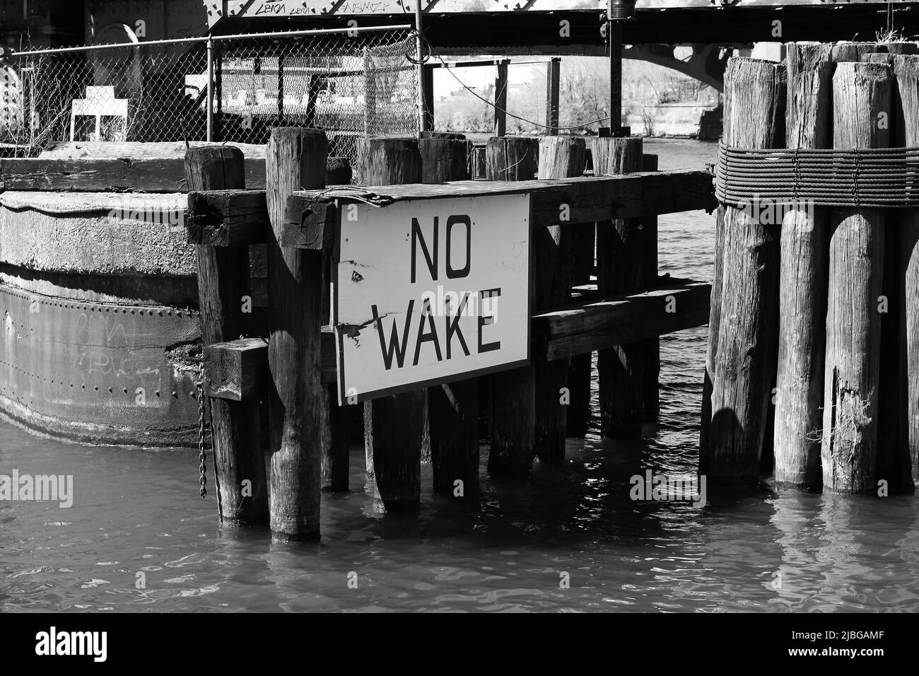 Warning sign on pier Black and White Stock Photos & Images - Alamy