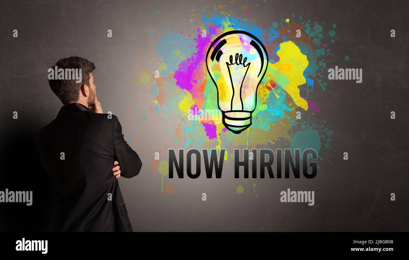 businessman drawing colorful light bulb Stock Photo - Alamy