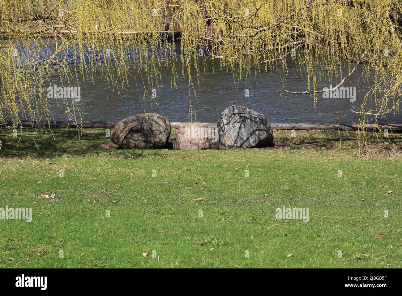 Huge boulders in the park near the river Stock Photo - Alamy
