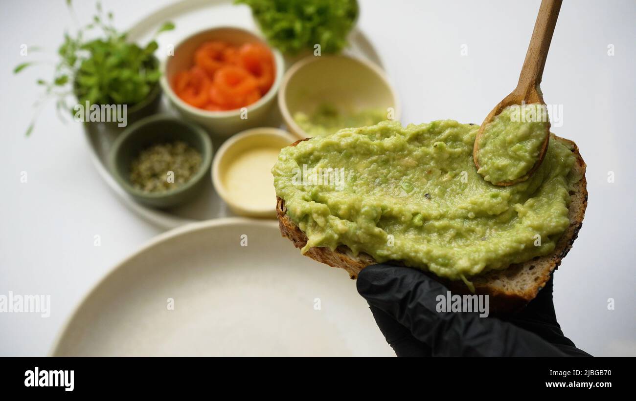 Cook in black gloves spreads hi-res stock photography and images - Alamy
