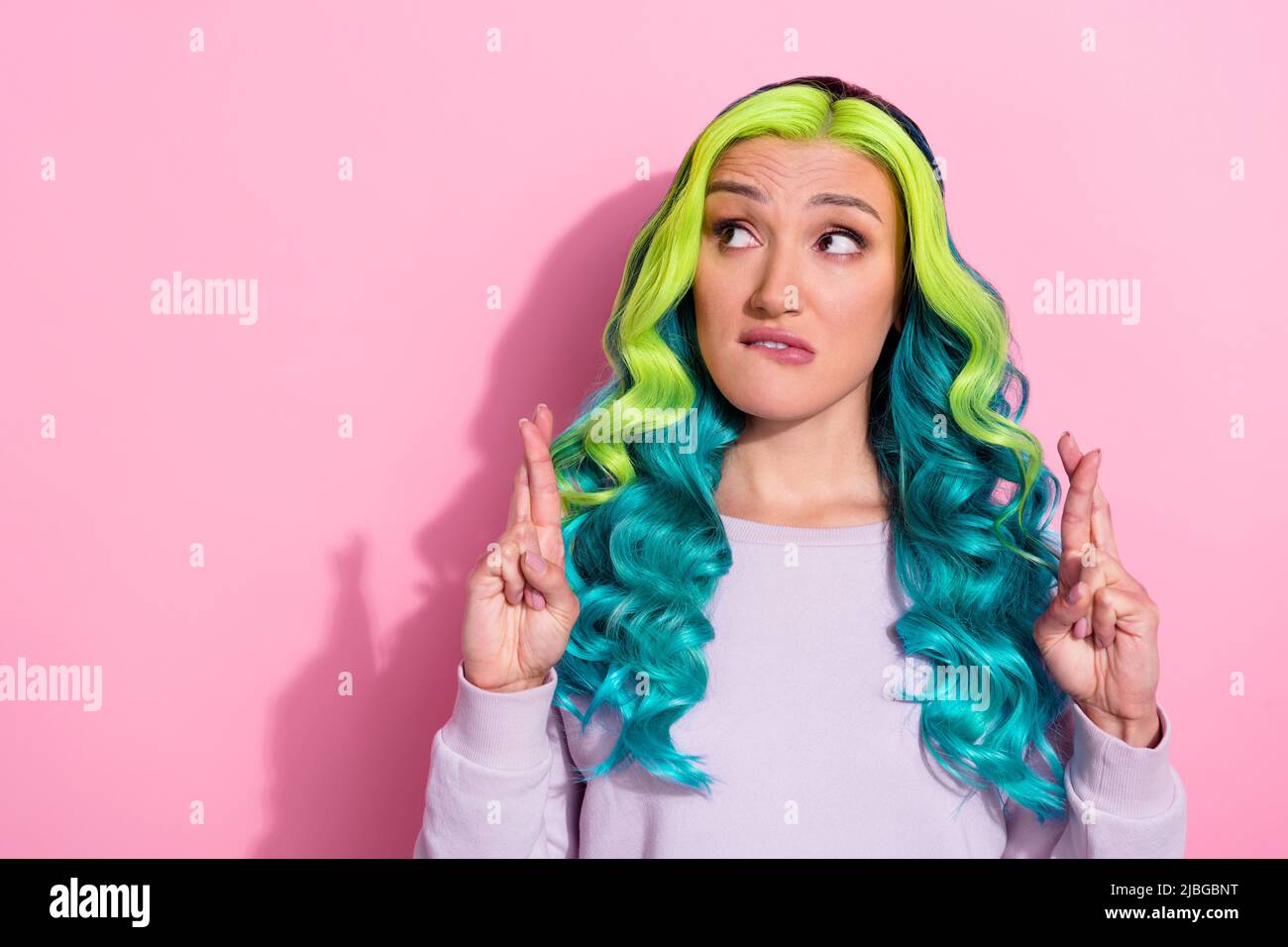 Photo of young female look empty space cross fingers dreaming ...