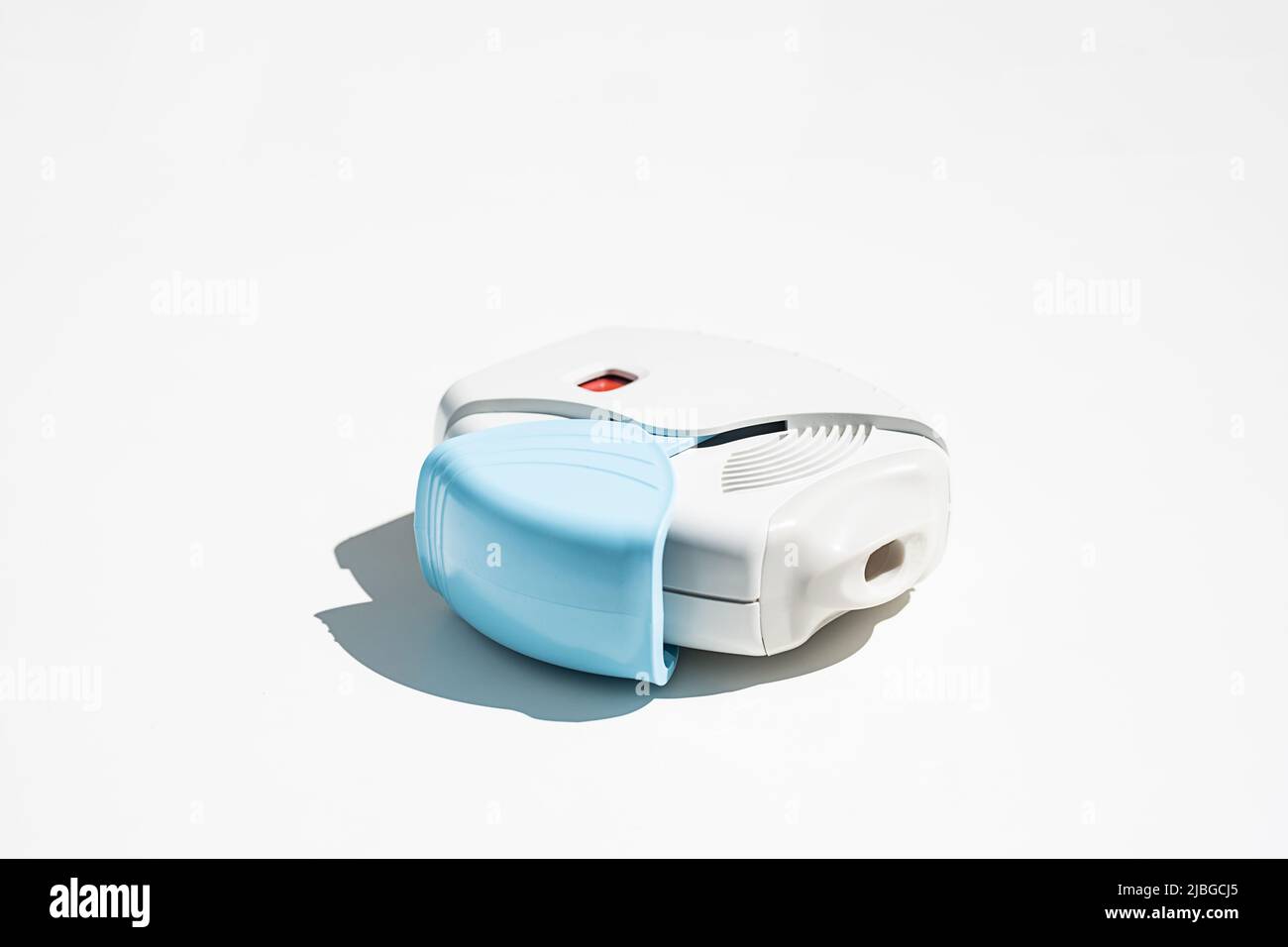 Asthma inhaler on white table. Aerosol for inhalation for treat lung ...