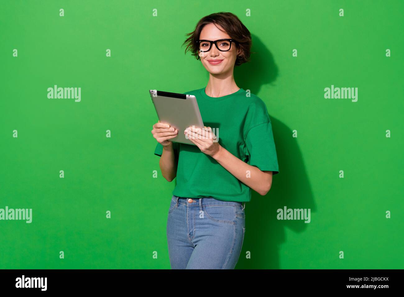 Photo of smart clever woman wear casual t-shirt eyeglasses reading ...
