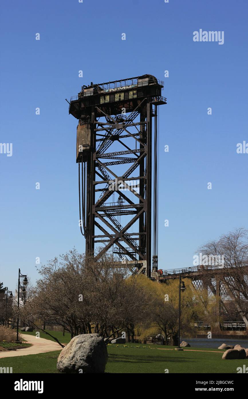 A very tall steel truss structure standing in the industrial district ...