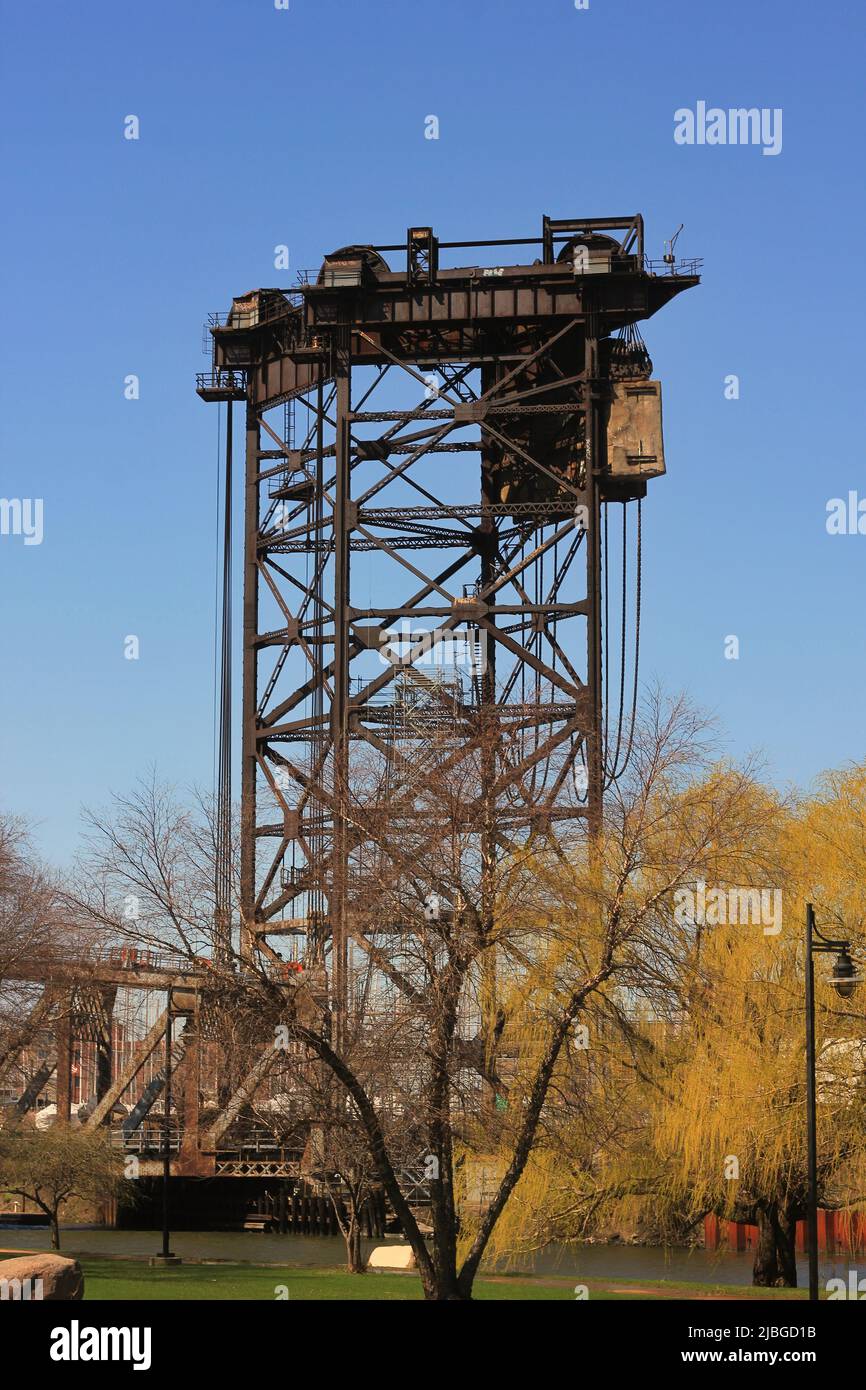 A very tall steel truss structure standing in the industrial district ...