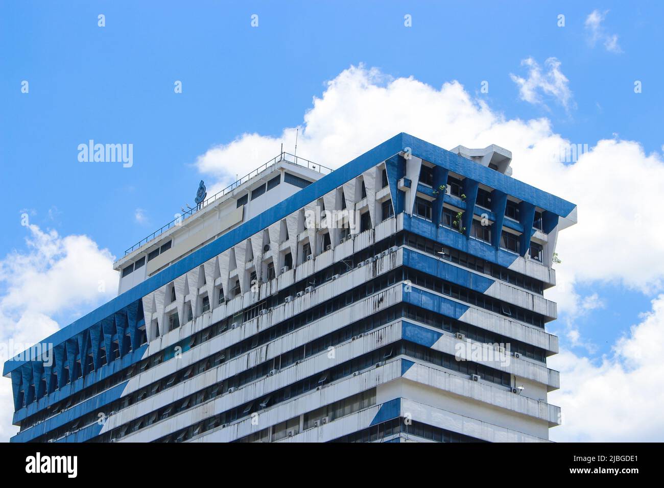 Old tall building with diagonal blue colour pattern in downtown in ...