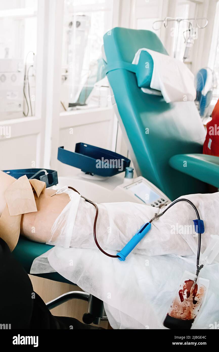 International Blood Donation Day. Man donates blood in medical ...