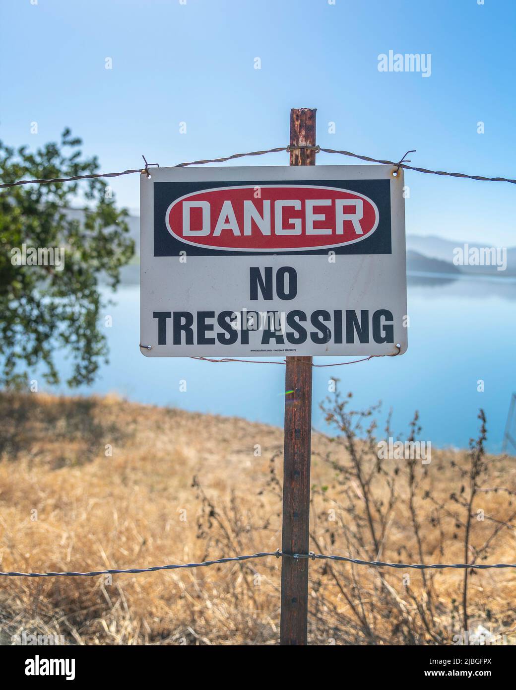Close up of a posted danger no trespassing sign Stock Photo - Alamy