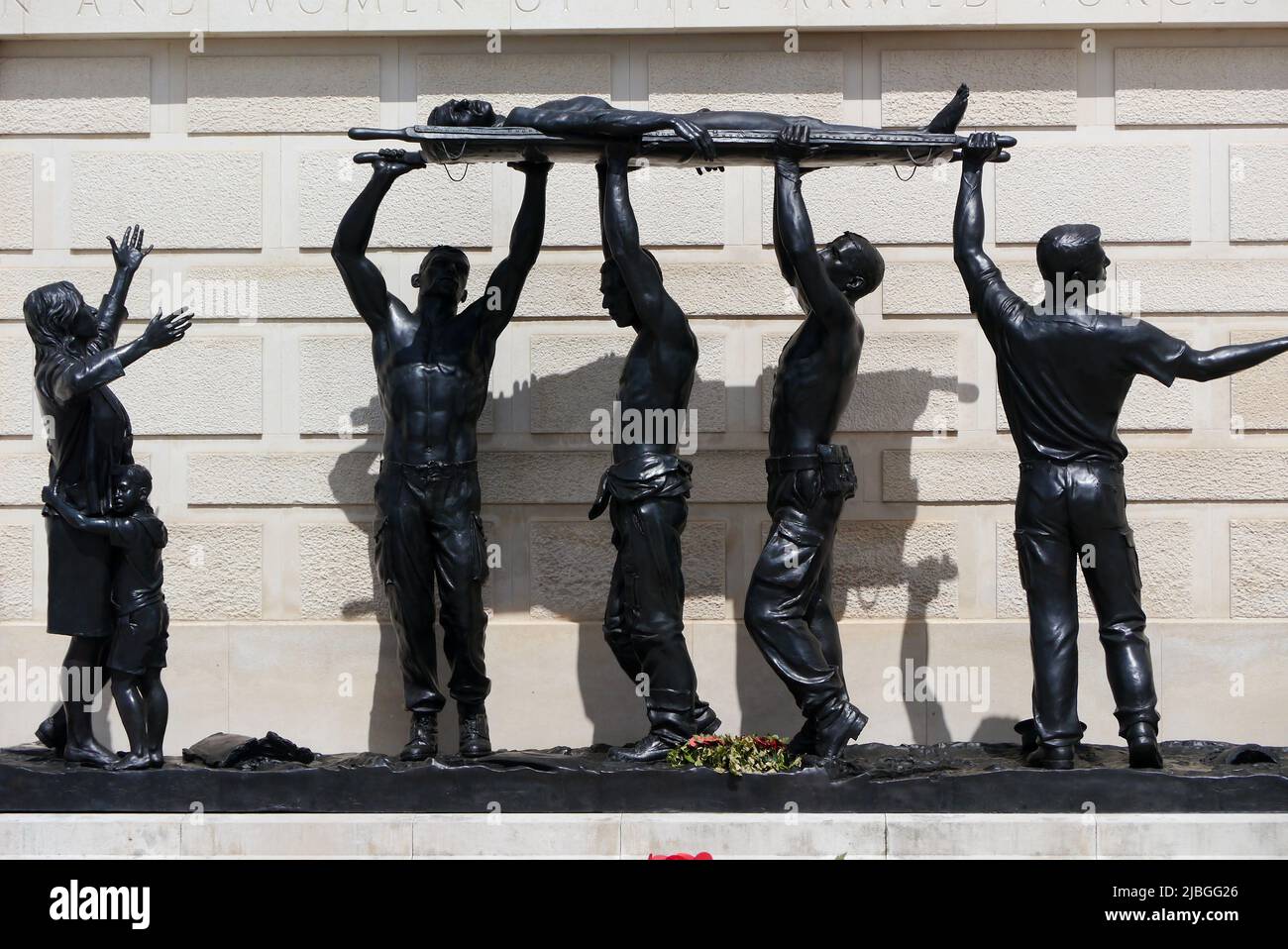 The Armed Forces Memorial with Bronze Statues next to White Portland ...