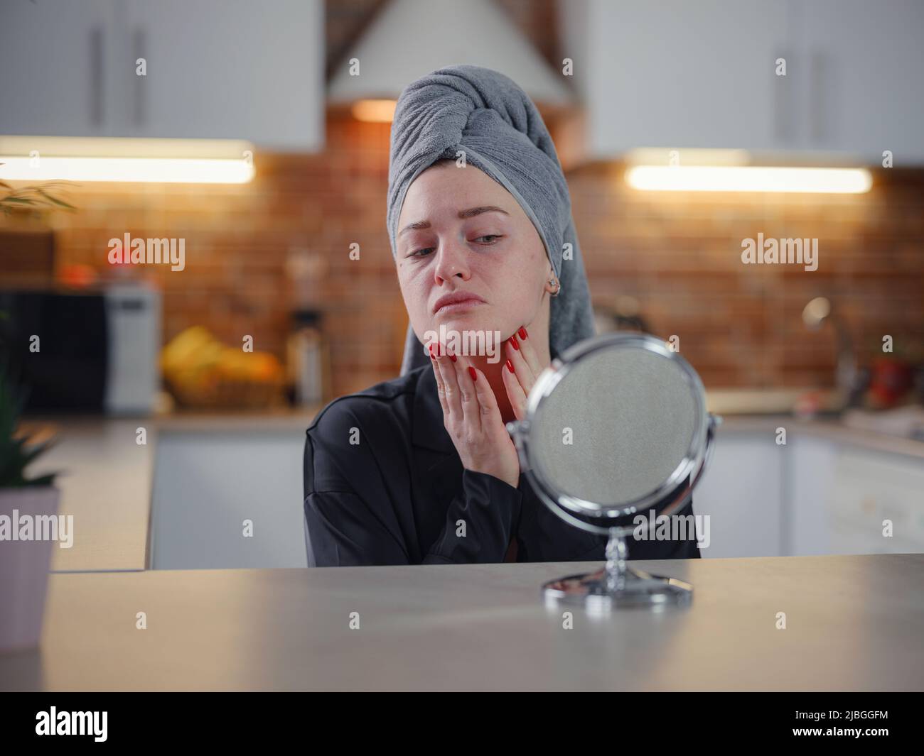 woman feeling shock while looking problem with skin condition after ...