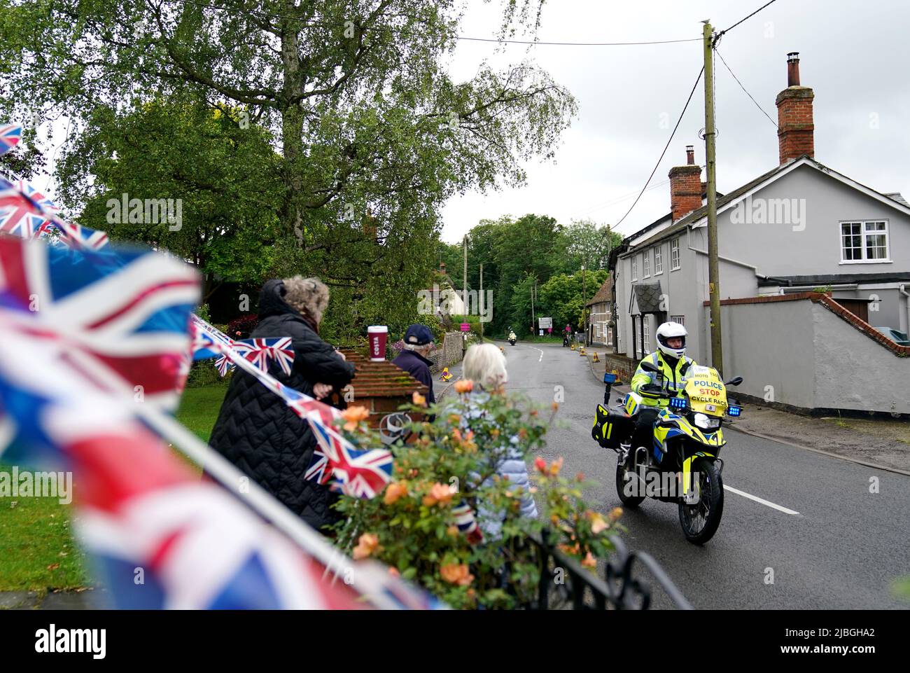 Police outriders pass through the village of Bildeston during stage one ...